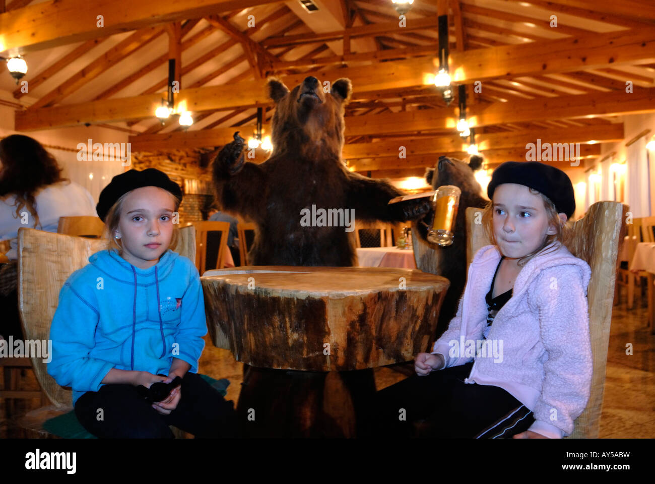 Two children sitting besides two stuffed bears. Plitvice Lakes National ...