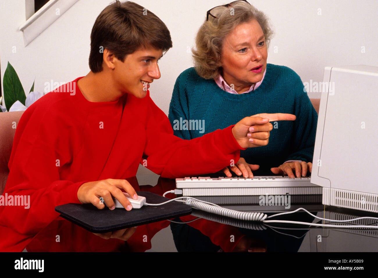 Grandson Teaching Grandmother Computer Stock Photo - Alamy