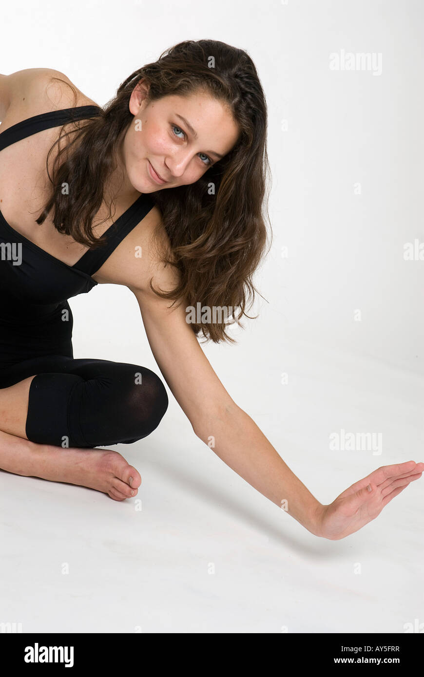 Beautiful young woman doing modern dance pose Stock Photo - Alamy