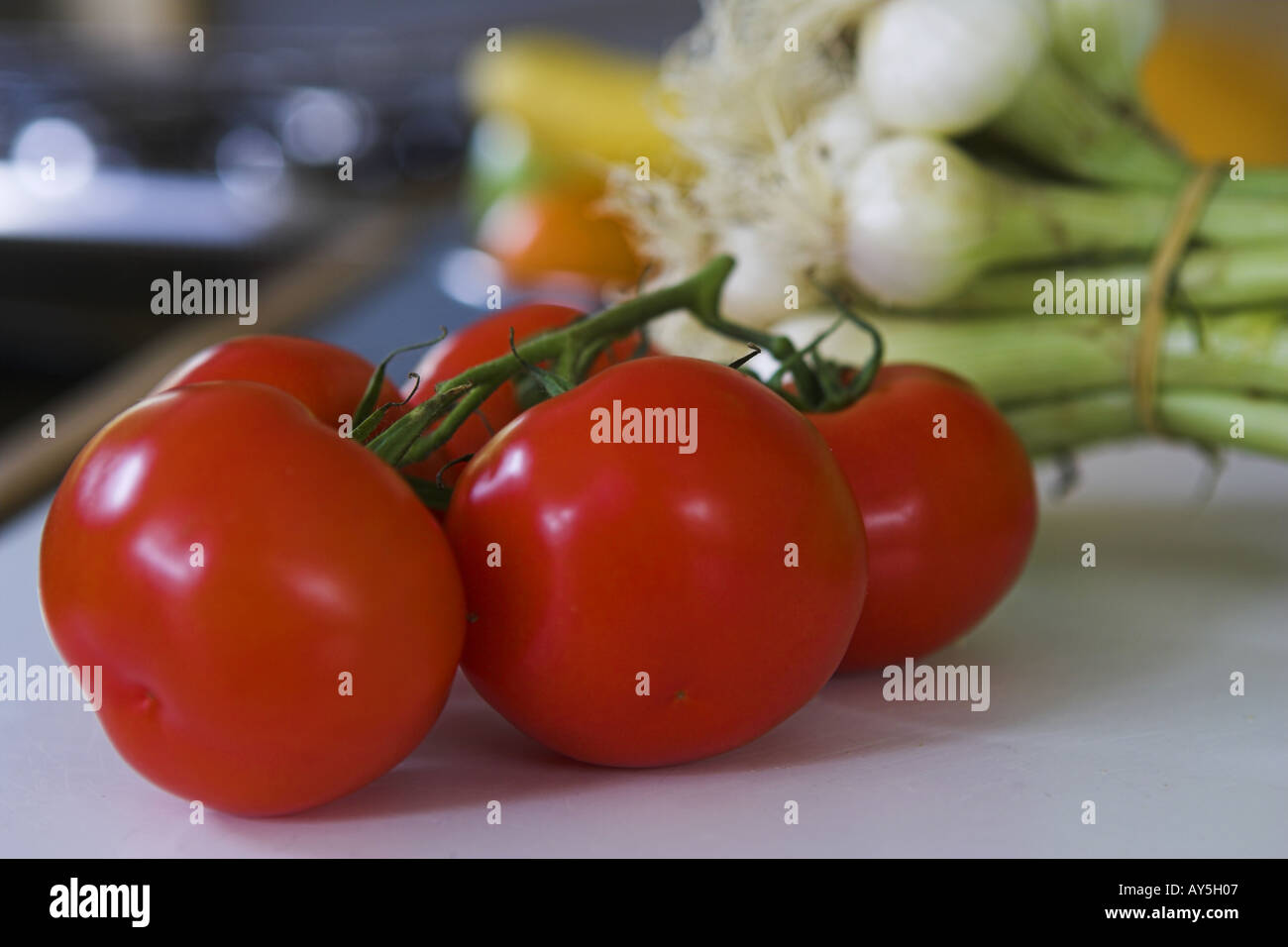 Tomato fruit and spring onions Stock Photo - Alamy