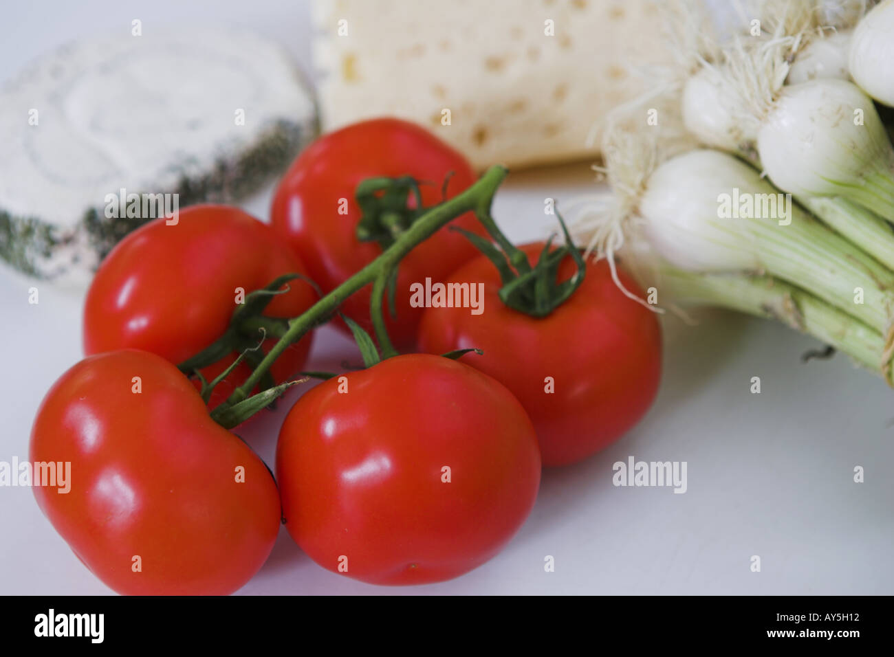 Tomato fruit and spring onions Stock Photo - Alamy