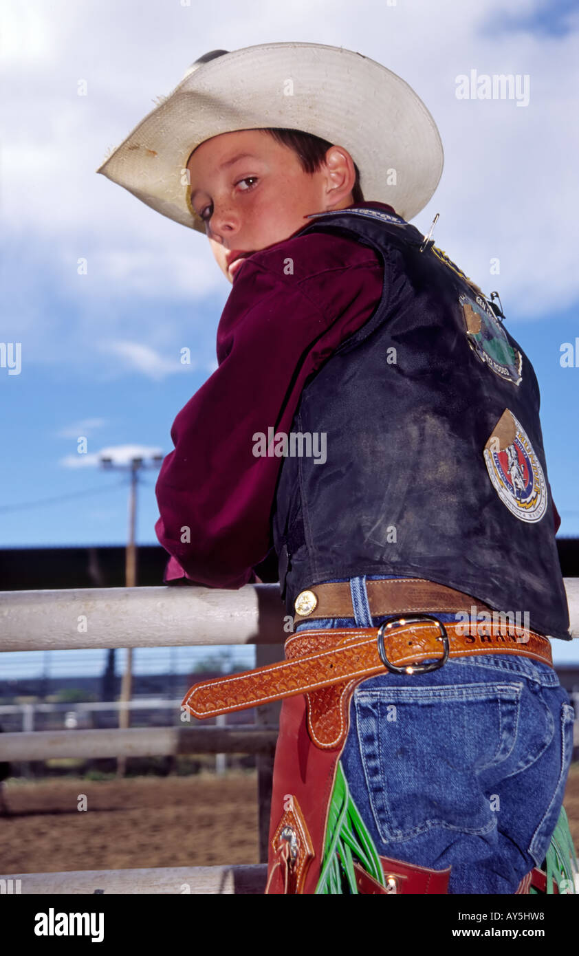 This young cowboy has a great view to watch the horse action, at the ...