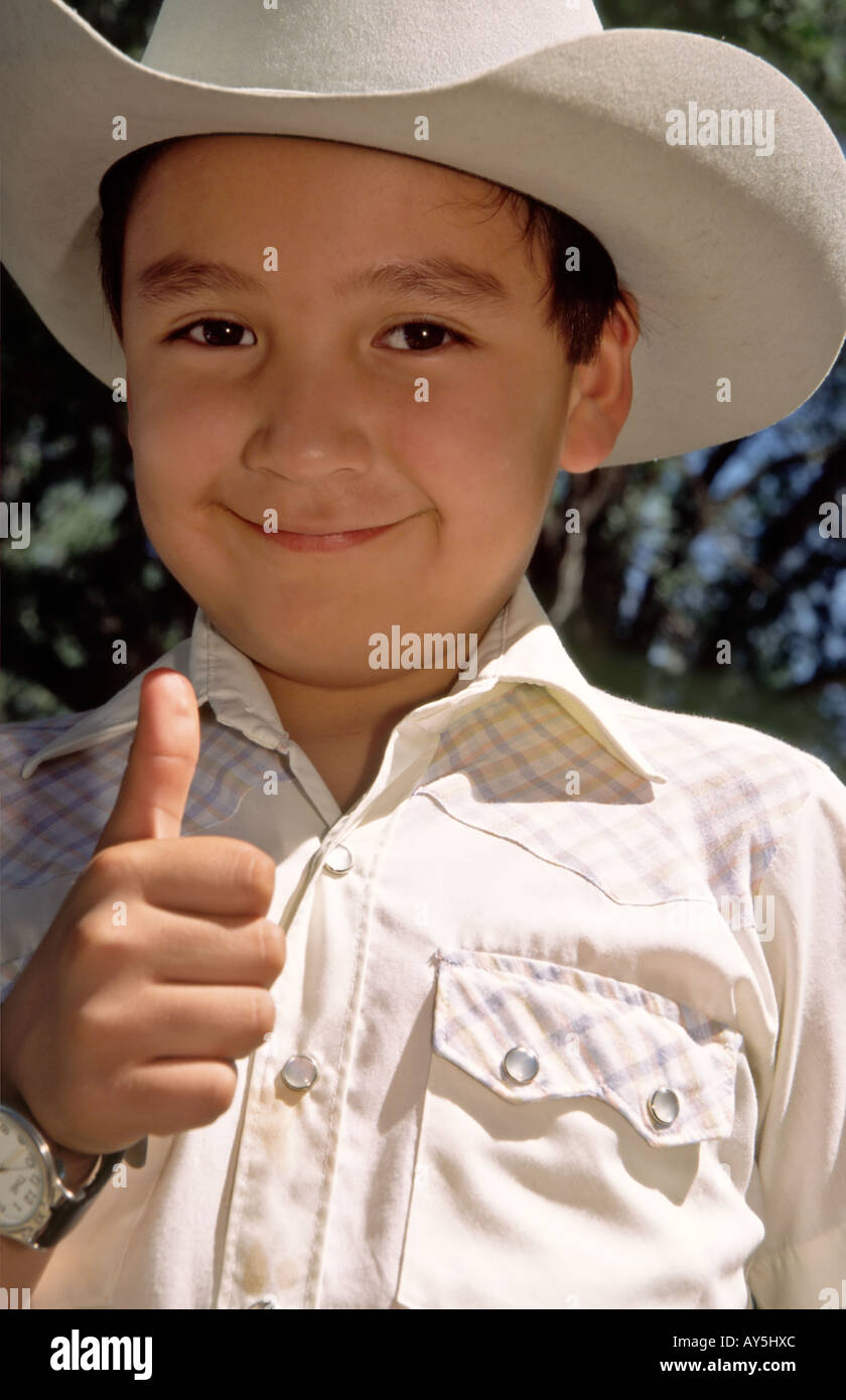 A young Hispanic cowboy gives a "thumbs up" at the 4th of July ...