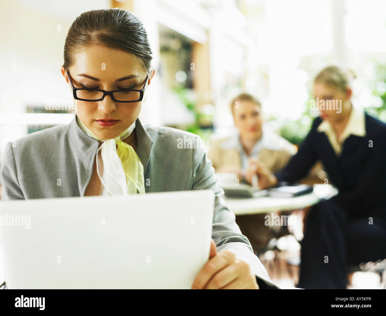 Businesswoman watching her laptop screen Stock Photo - Alamy
