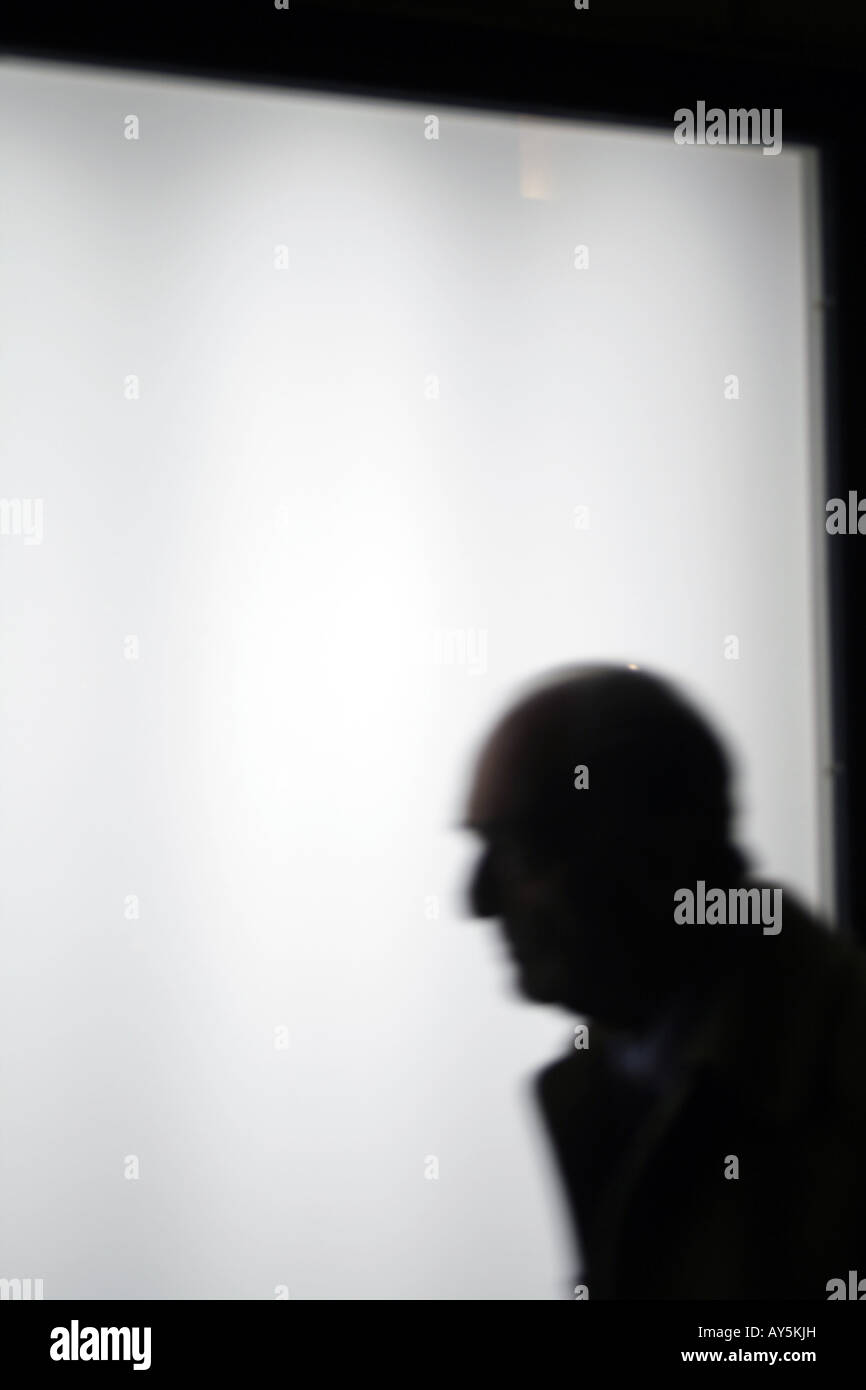 person passing neon light at night Stock Photo - Alamy