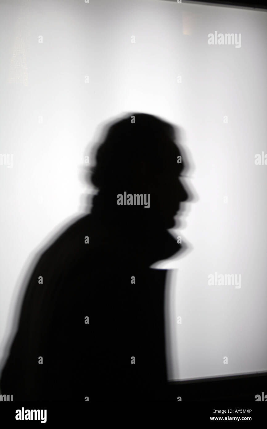 person passing neon light at night Stock Photo - Alamy