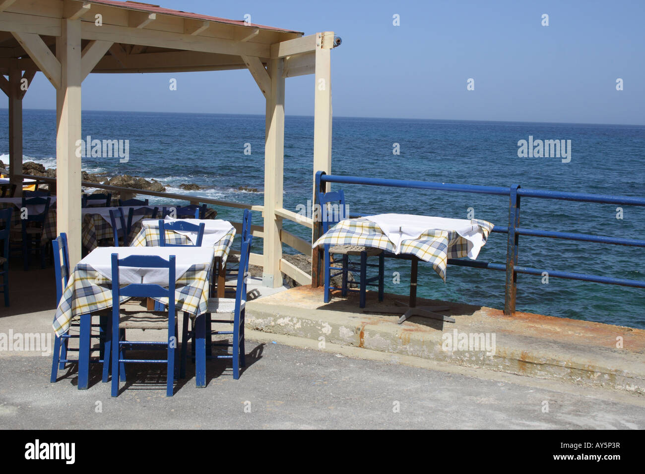 outside Greek restaurant table at the beach, Agios Nikolaos, Gulf of ...