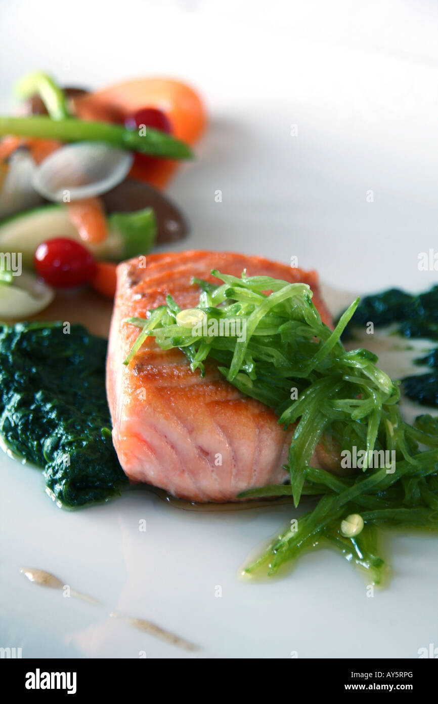 Grilled salmon steak with julienne vegetables Stock Photo - Alamy