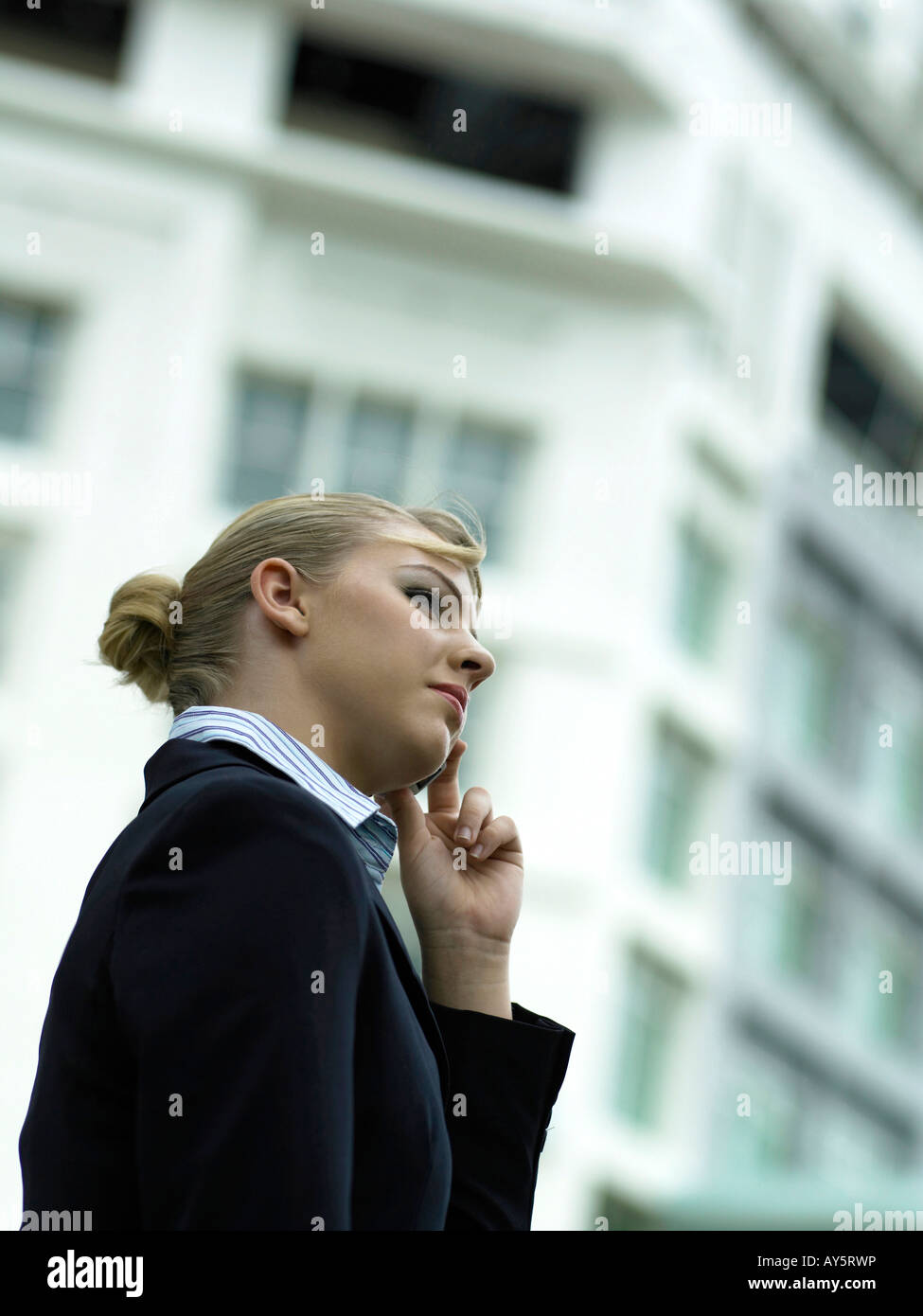 A young woman having discussion on her mobile phone Stock Photo - Alamy