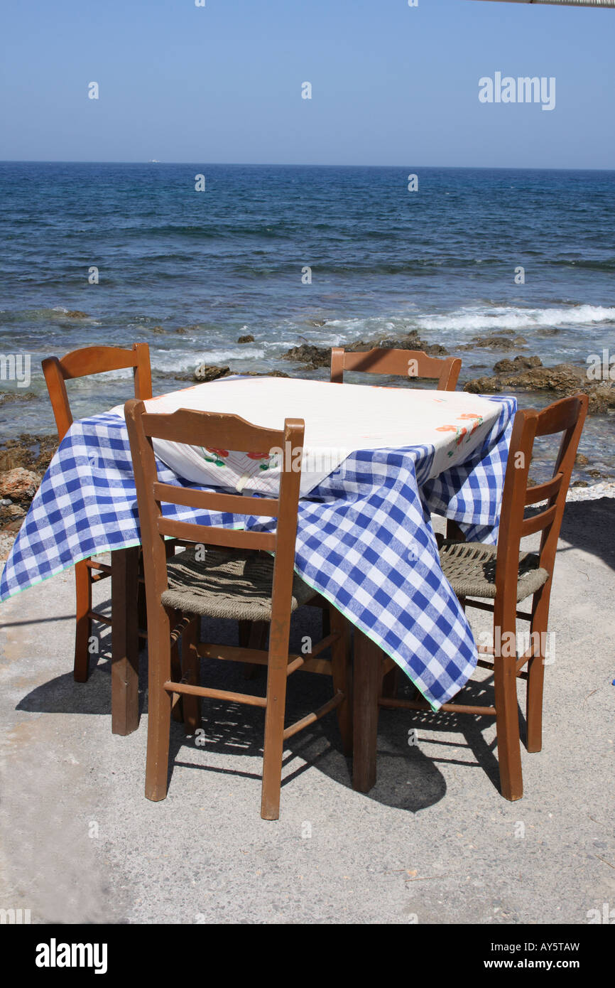 outside Greek restaurant table at the beach, Agios Nikolaos, Gulf of ...