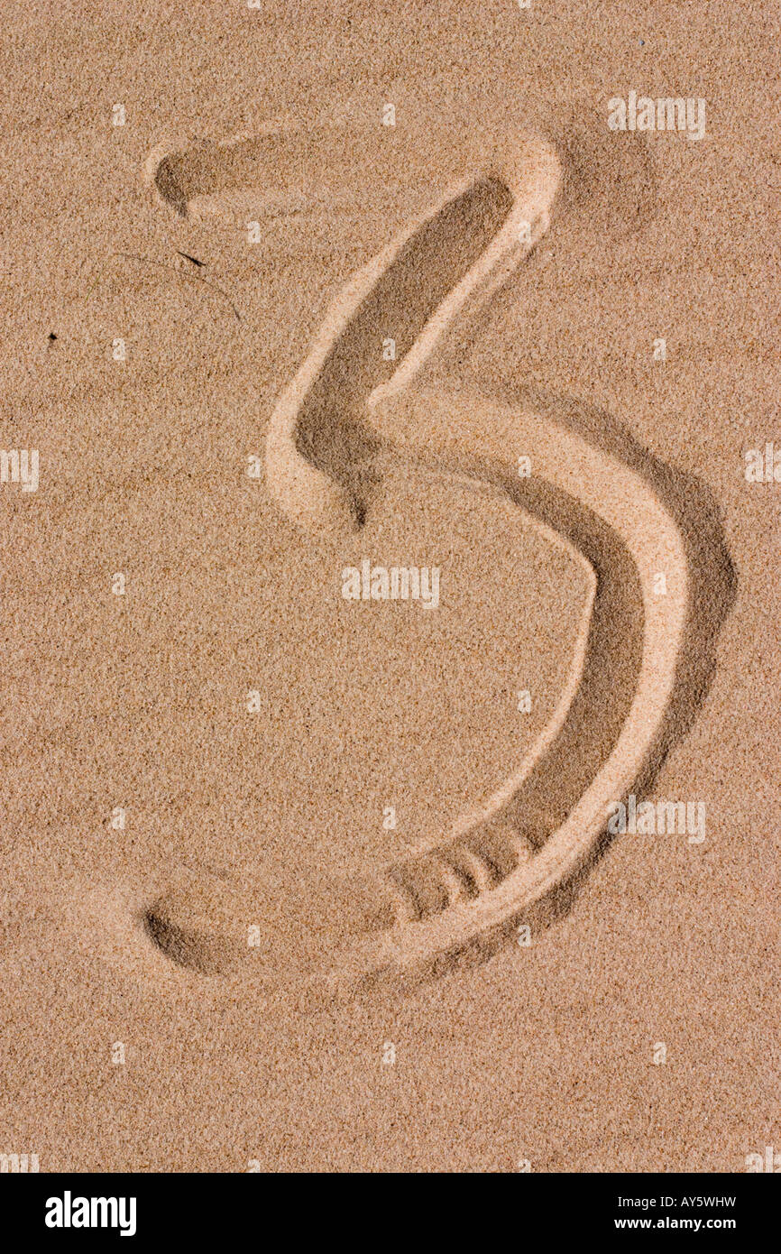 Numbers written on sand Stock Photo - Alamy