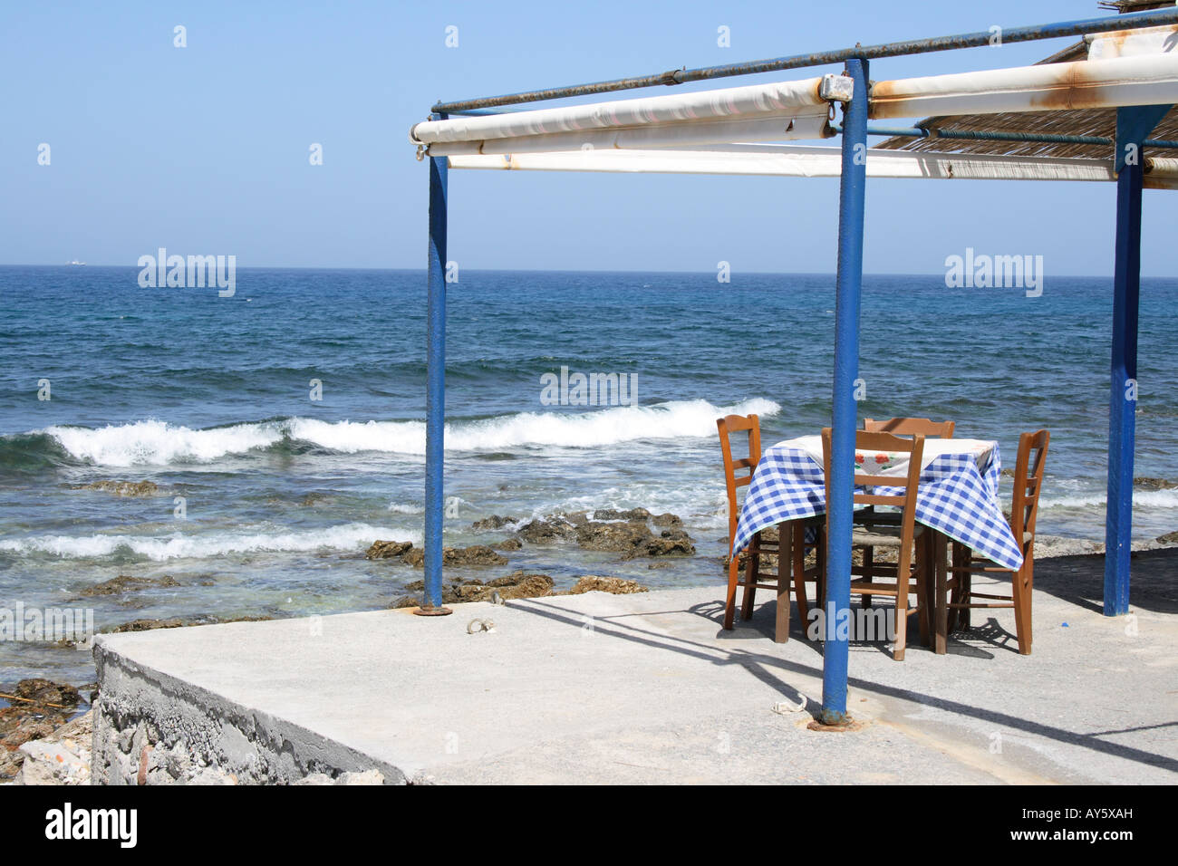 Outside greek restaurant table beach hi-res stock photography and ...