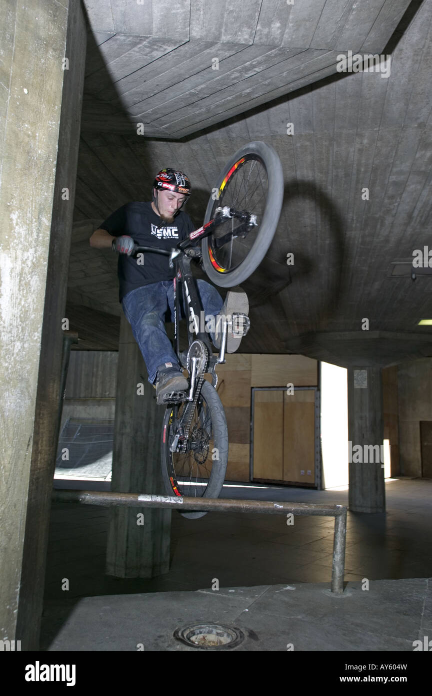 A mountain biker performing a stunt in a street environment Stock Photo ...