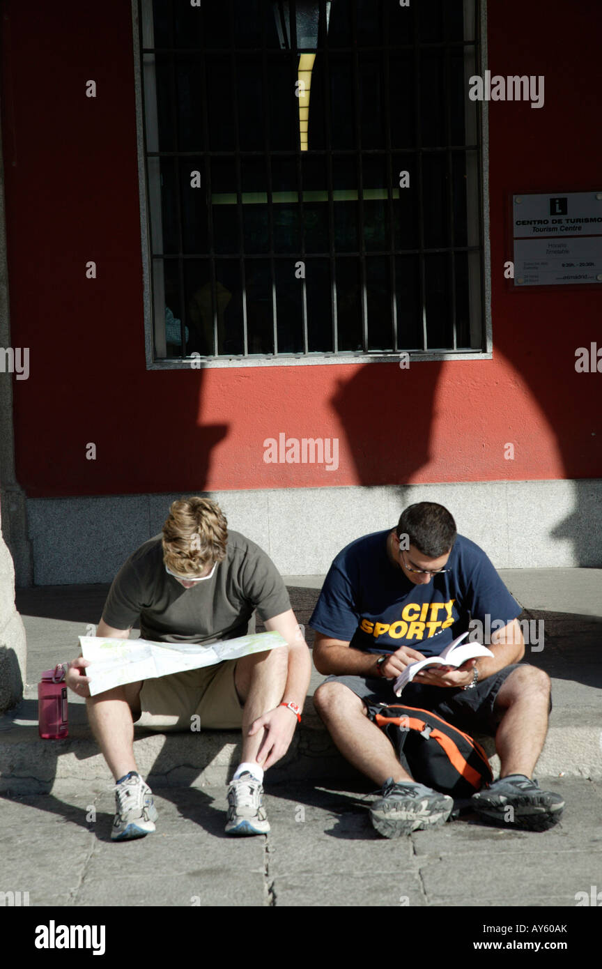 Two boys study a map in Plaza Mayor, Madrid, Spain Stock Photo - Alamy
