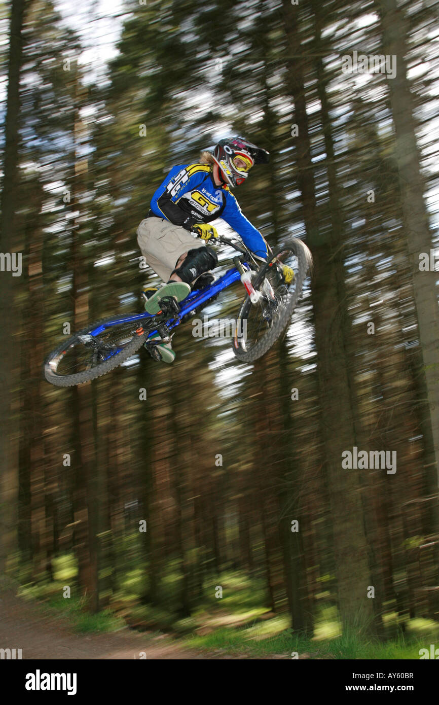 A mountain biker jumps his mountain bike through the air Stock Photo ...