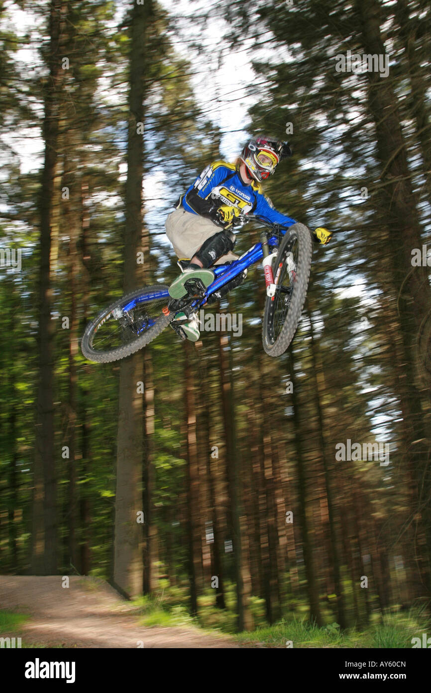 A mountain biker jumps his mountain bike through the air Stock Photo ...