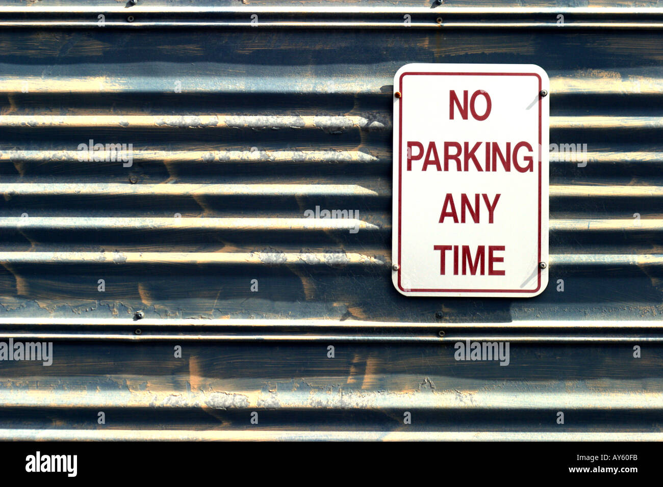 No parking sign against a blue textured background Stock Photo - Alamy