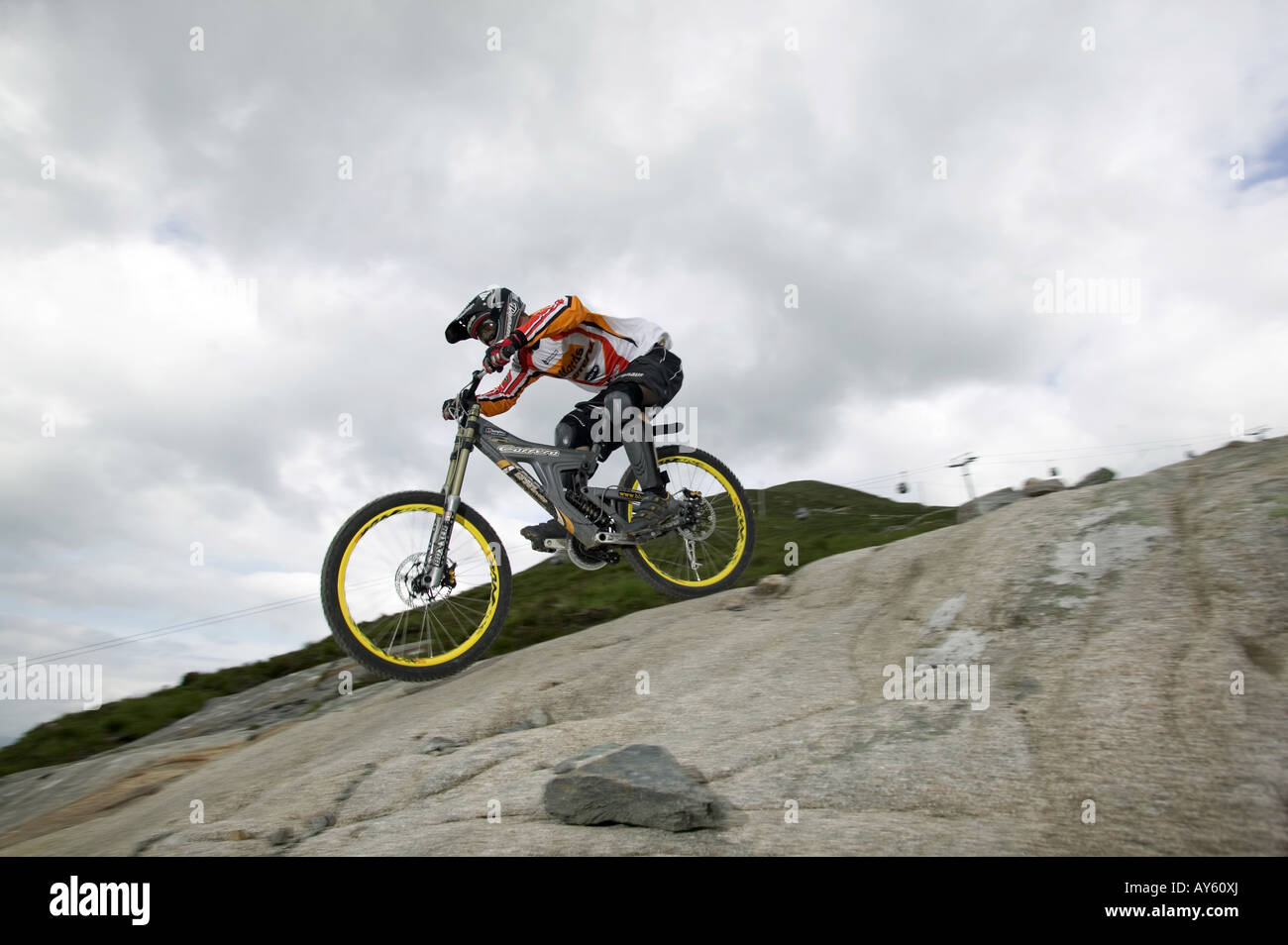 A Downhill mountainbike racer in action Stock Photo - Alamy