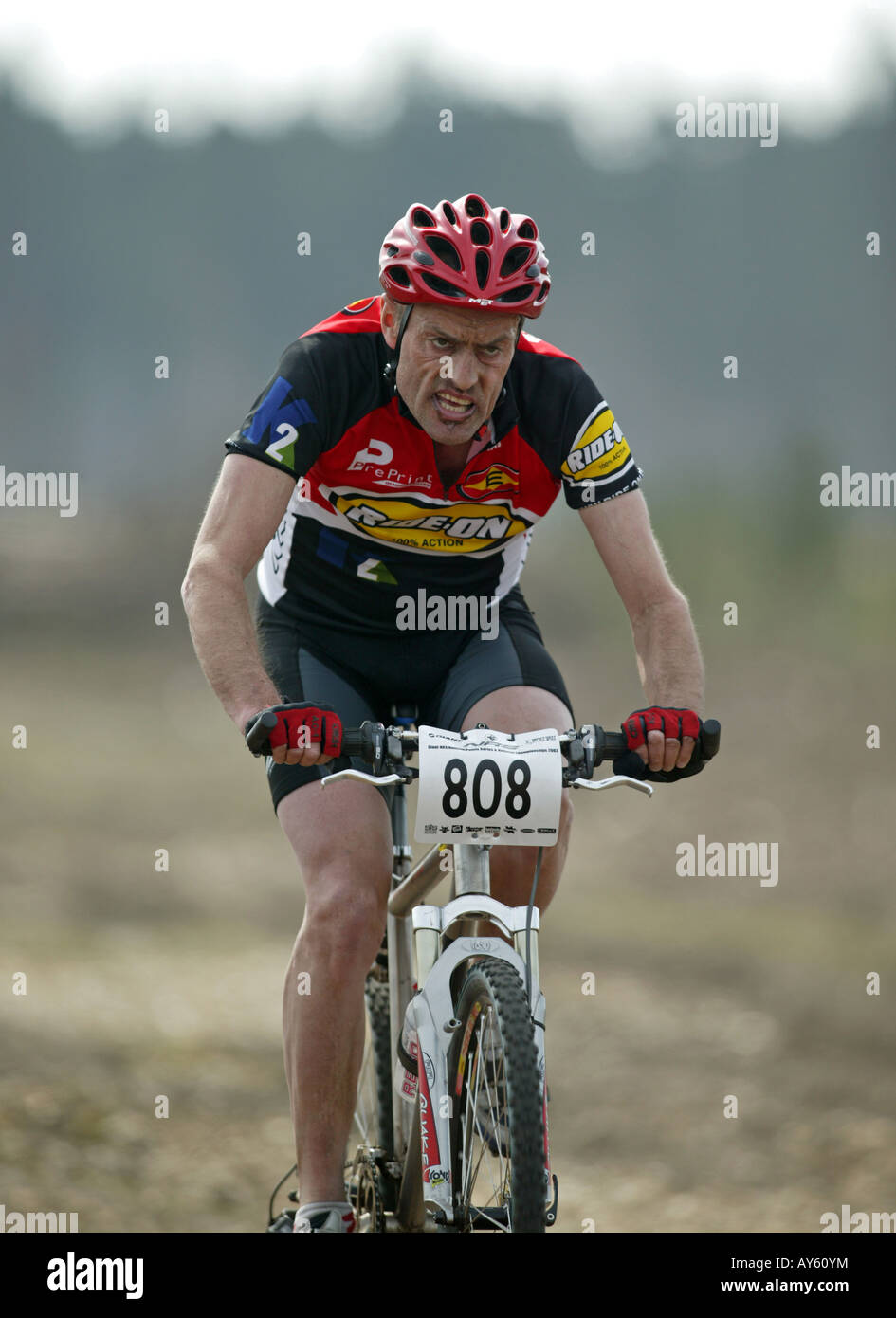 A Cross country mountain bike racer in action Stock Photo - Alamy