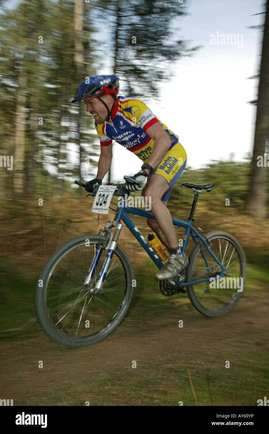 A Cross country mountain bike racer in action Stock Photo - Alamy