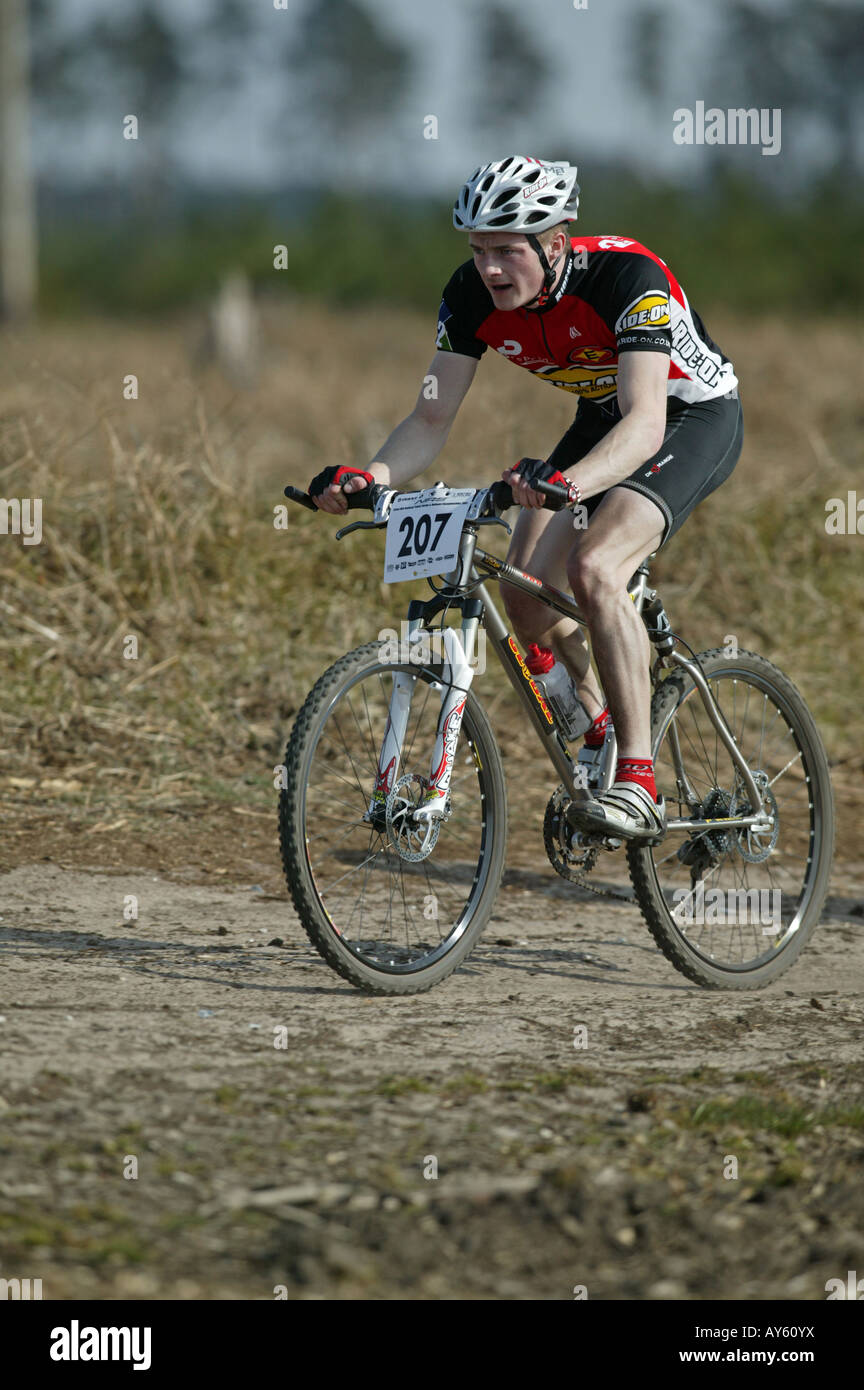 A Cross country mountain bike racer in action Stock Photo - Alamy