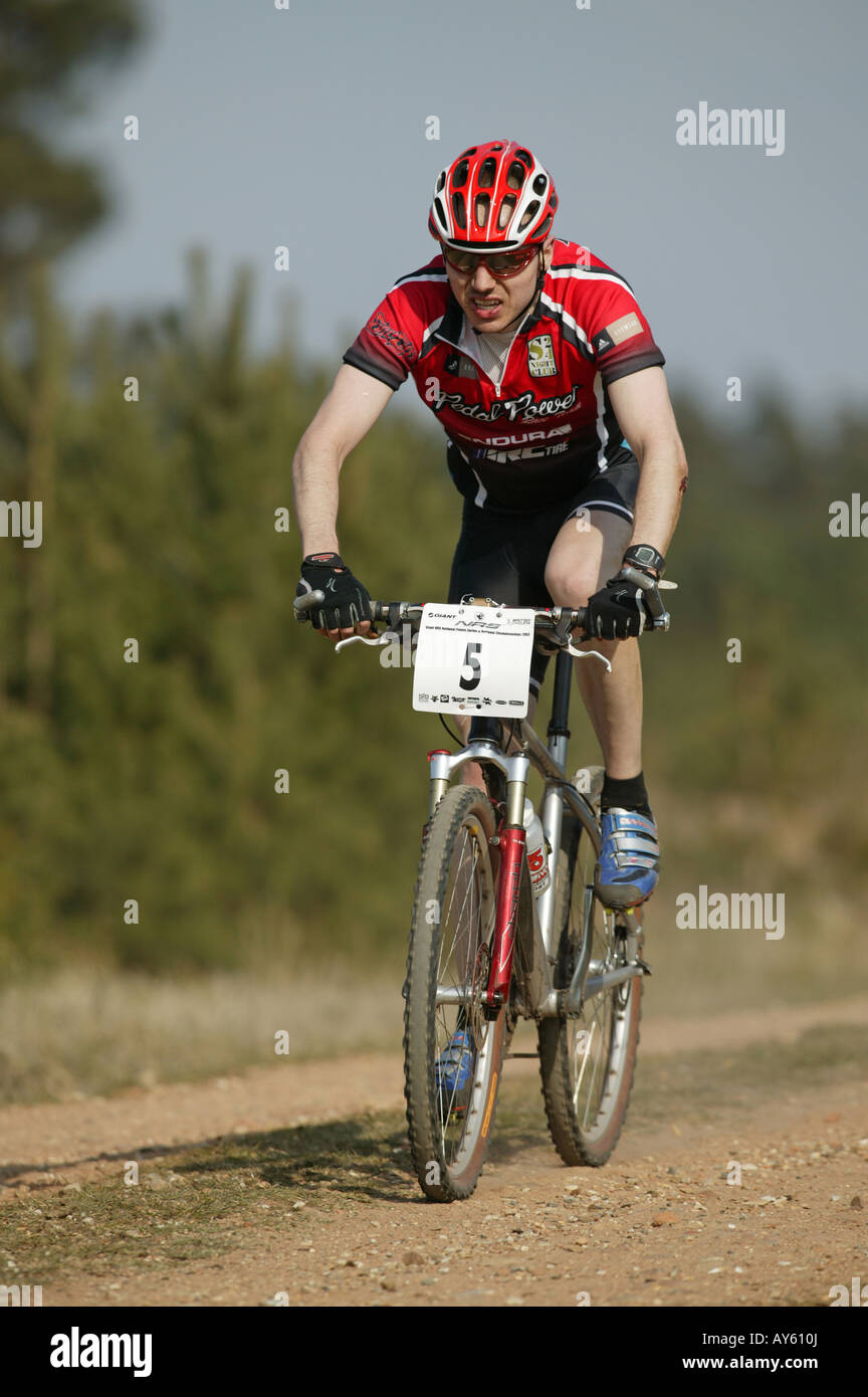 A Cross country mountain bike racer in action Stock Photo - Alamy