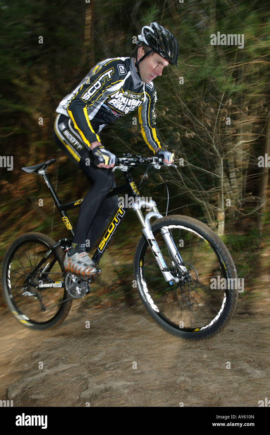 A Cross country mountain bike racer in action Stock Photo - Alamy