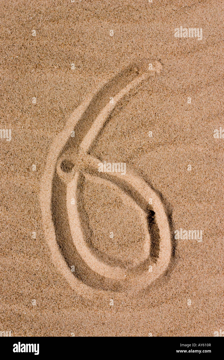Numbers written on sand Stock Photo - Alamy