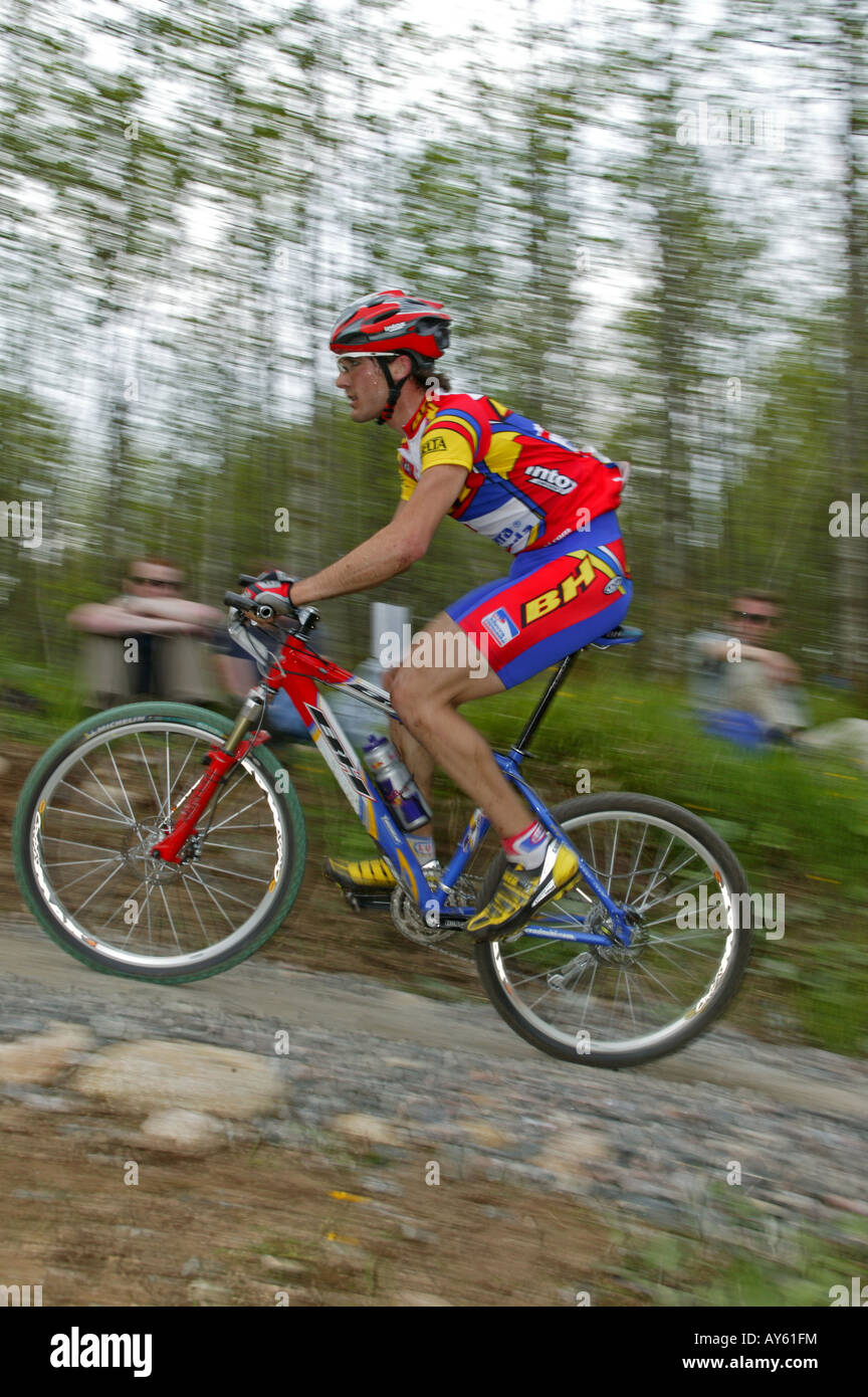 A Cross country mountain bike racer in action Stock Photo - Alamy