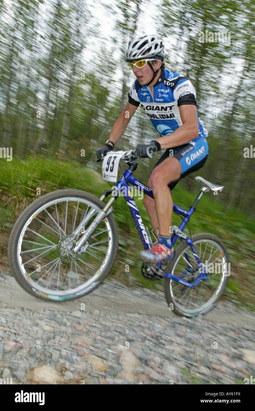 A Cross country mountain bike racer in action Stock Photo - Alamy