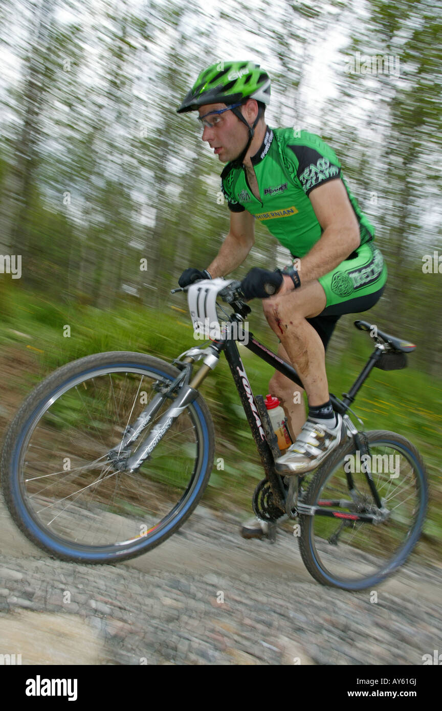 A Cross country mountain bike racer in action Stock Photo - Alamy