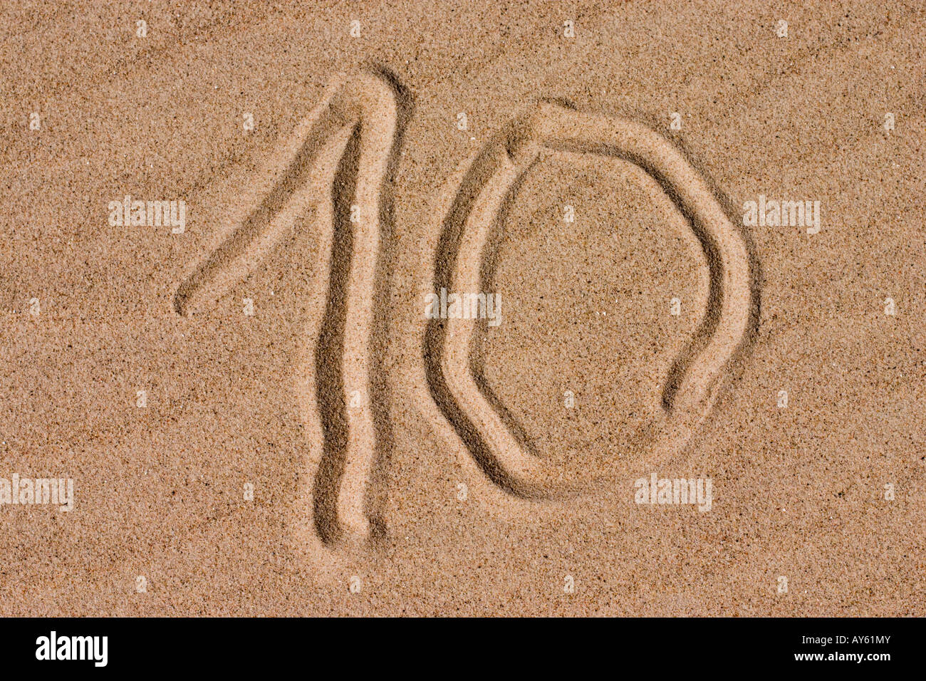 Numbers written on sand Stock Photo - Alamy