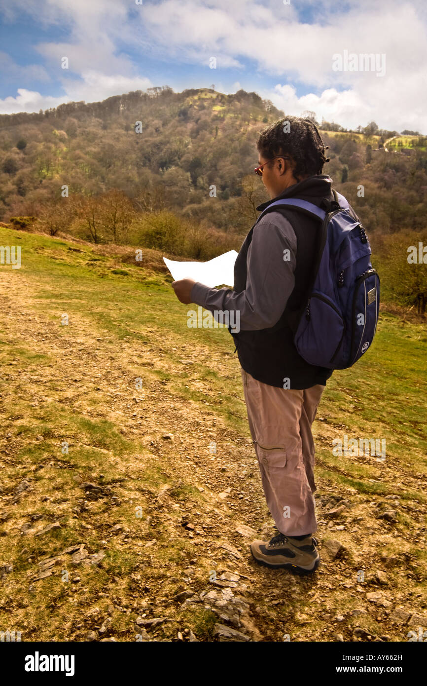 Female hillwalker reading map in English countryside Stock Photo - Alamy