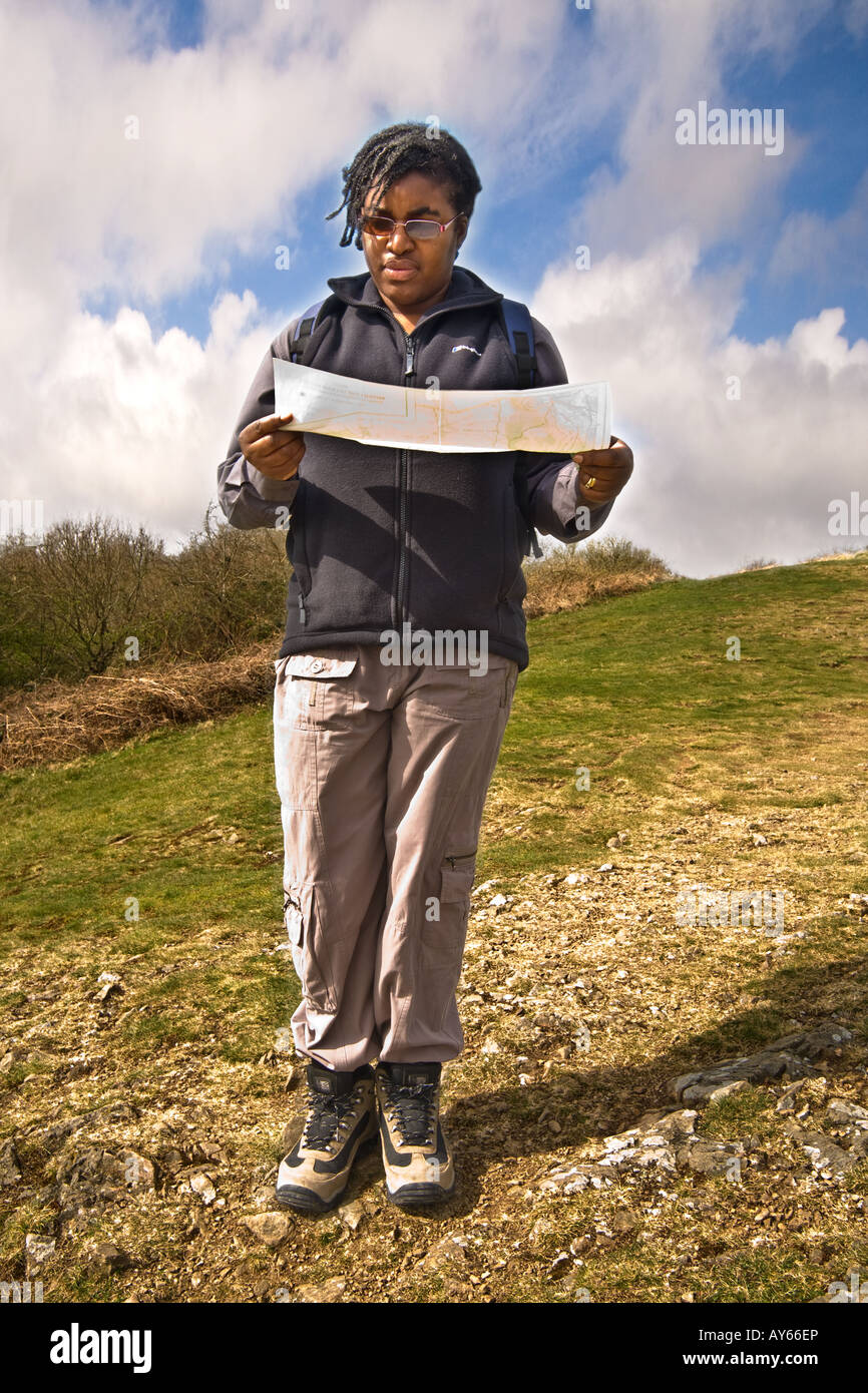 Female hillwalker reading map in English countryside Stock Photo - Alamy