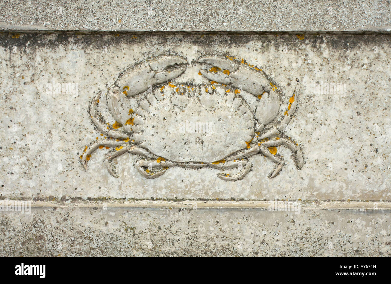 Carved stone panel on wall with crab motif Stock Photo - Alamy