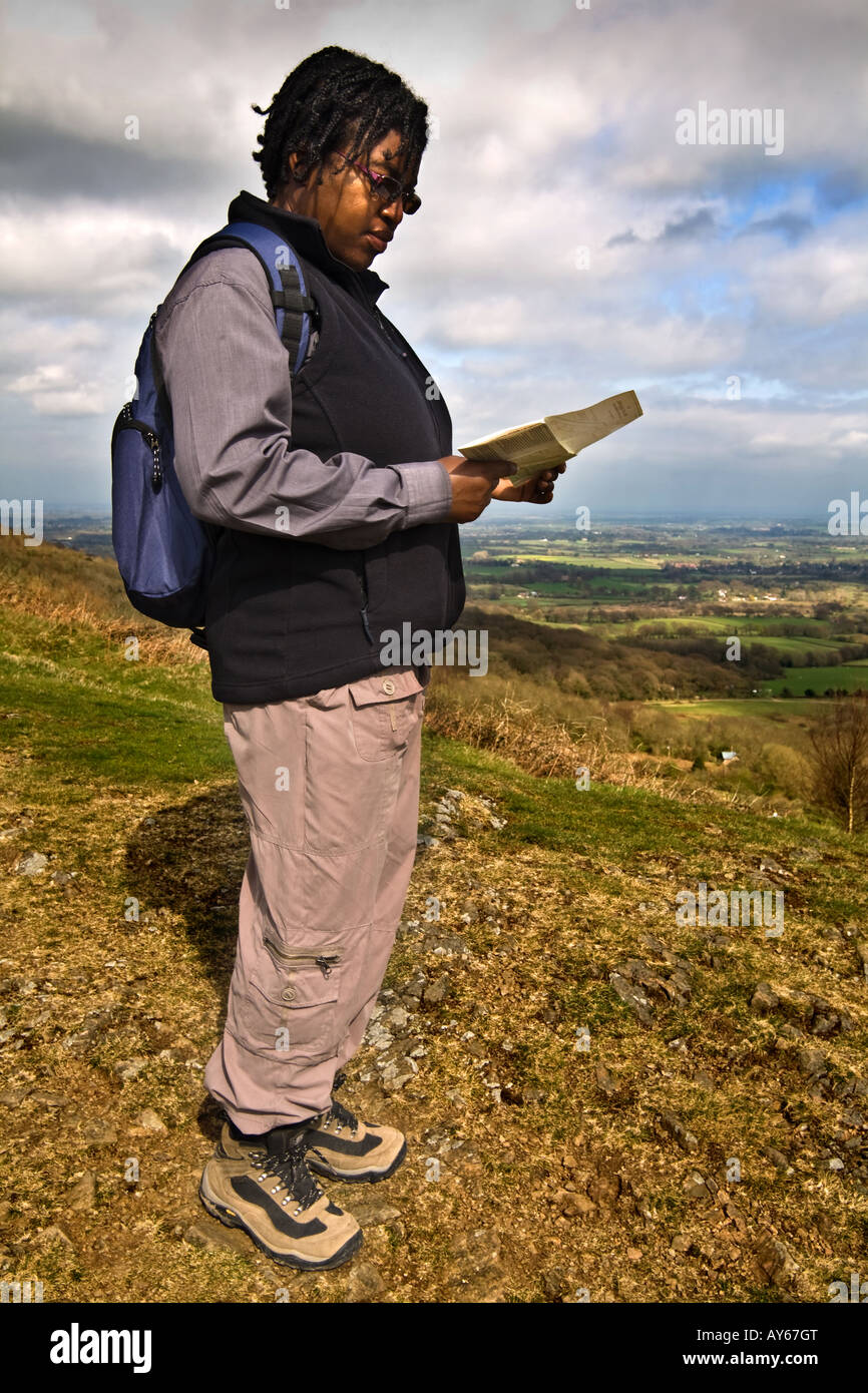 Female hillwalker consulting map in English countryside Stock Photo - Alamy