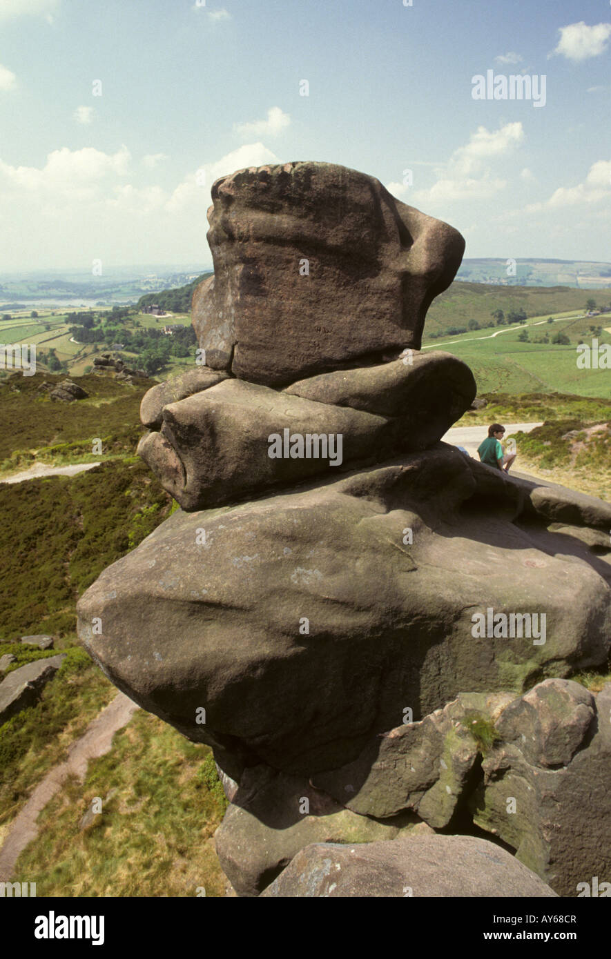 A boy clambers on The Roaches rocks, Staffordshire, England Stock Photo ...