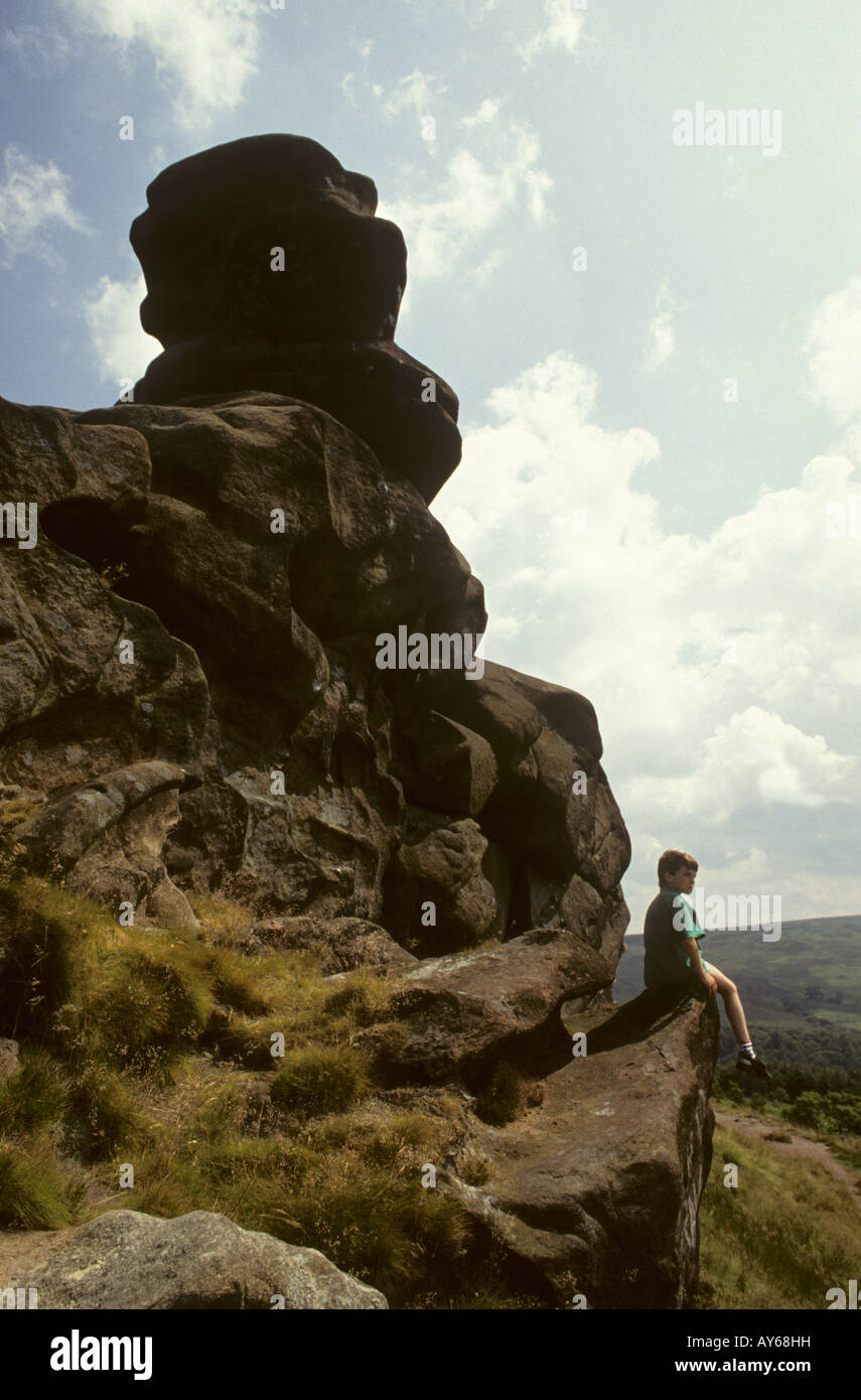 A boy clambers on The Roaches rocks, Staffordshire, England Stock Photo ...