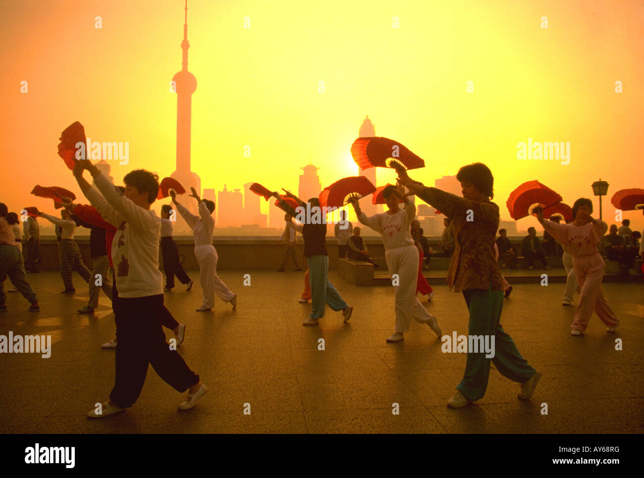 Shanghai morning exercise on the Bund with Pudong skyline in background ...