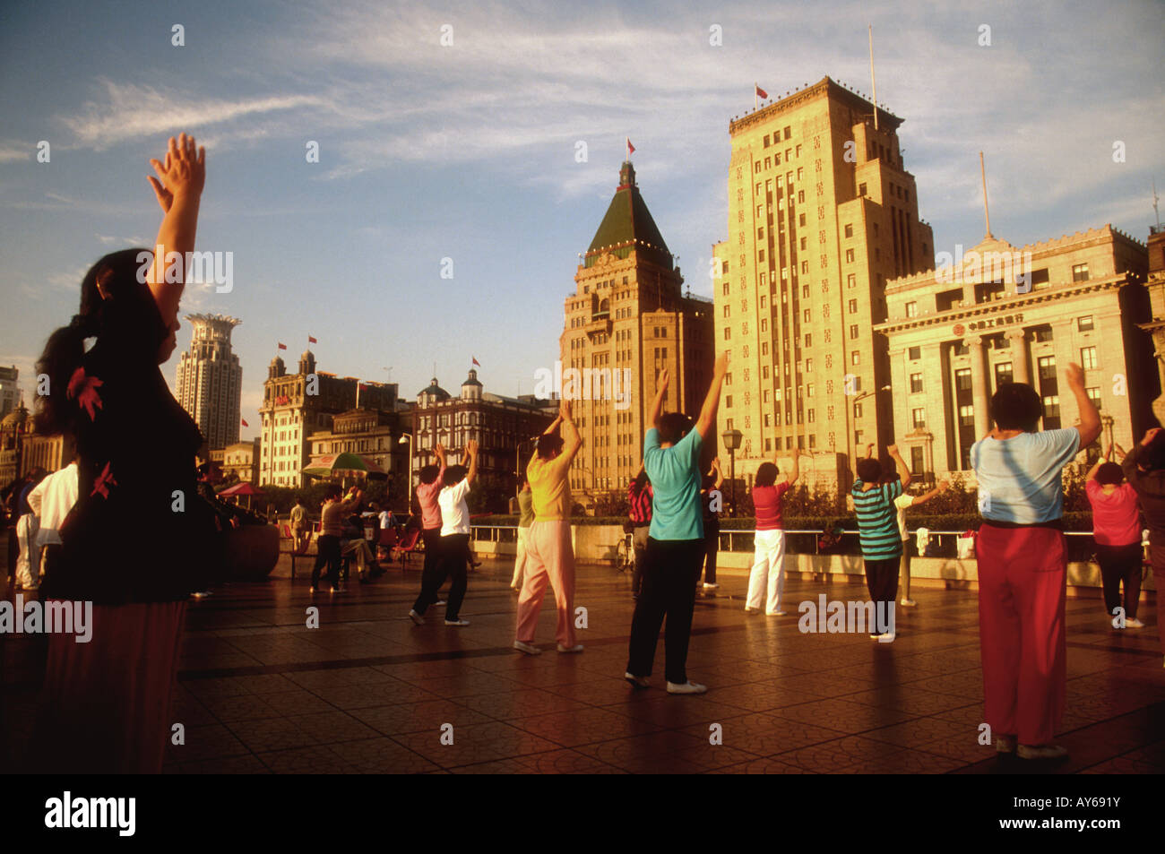 Shanghai residents exercise on the Bund in early morning Stock Photo ...