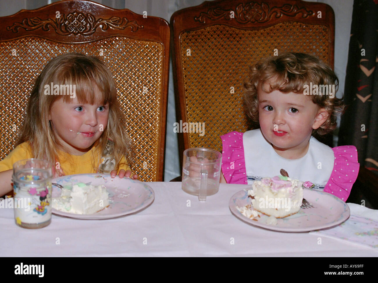 Two young female cousins at Birthday Party Stock Photo - Alamy