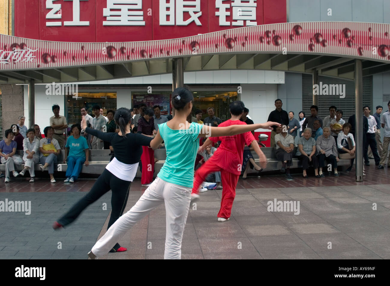 Morning dancers are practicing on the Nanjing Road in Shanghai Stock ...