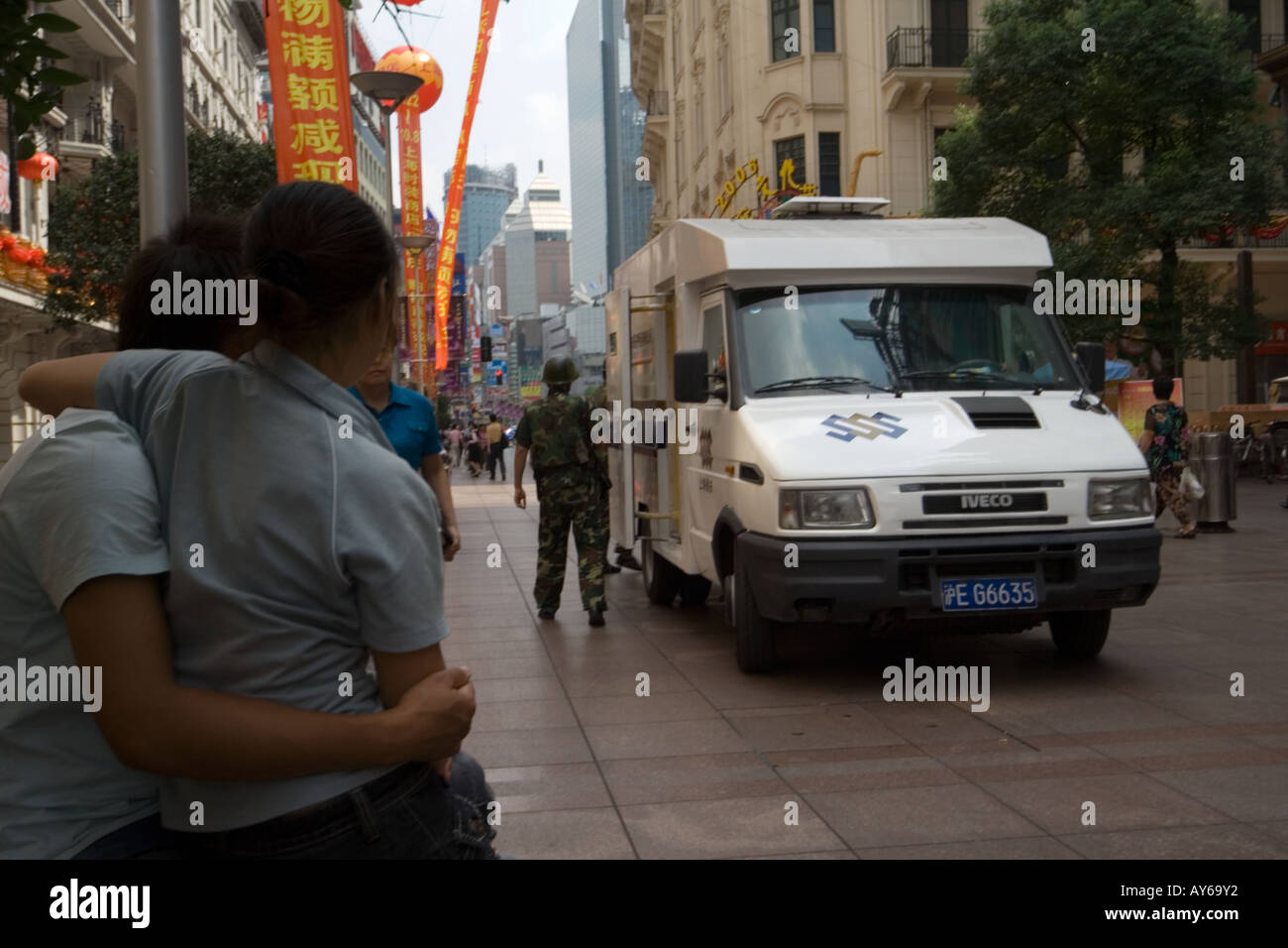 A heavily armed bank security corps are guarding in Nanjing Road in ...