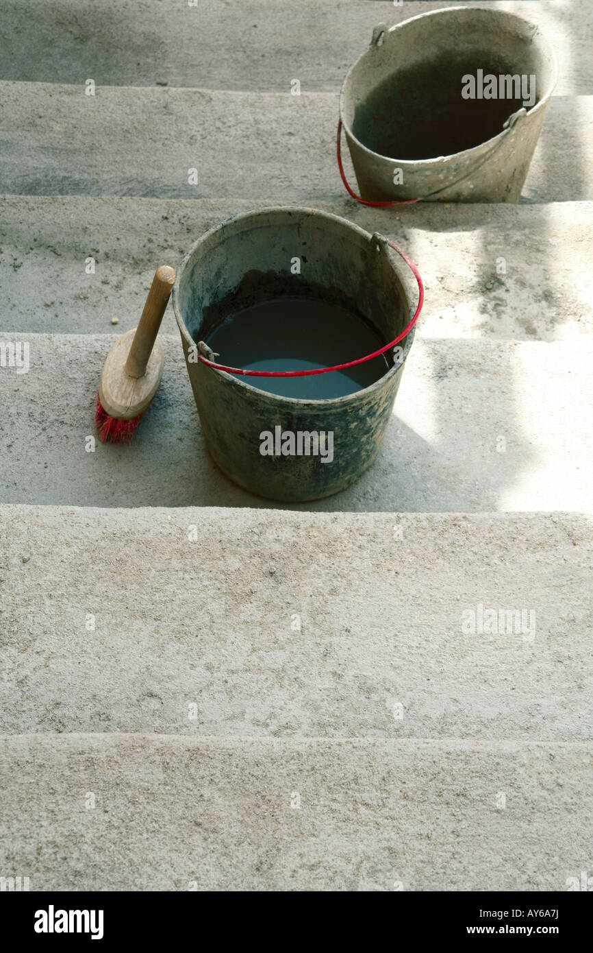 concrete bucket and brush Stock Photo - Alamy