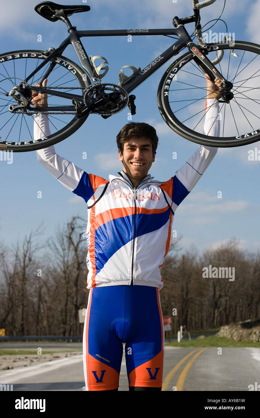 Portrait of a young male college age cyclist wearing his team's kit ...