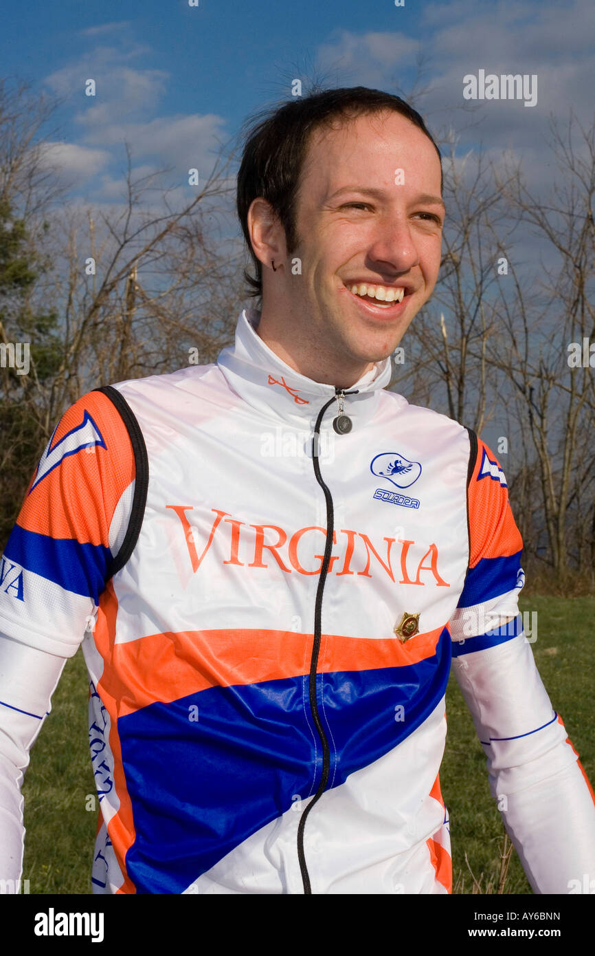 Portrait of a young male college age cyclist wearing his team's kit ...