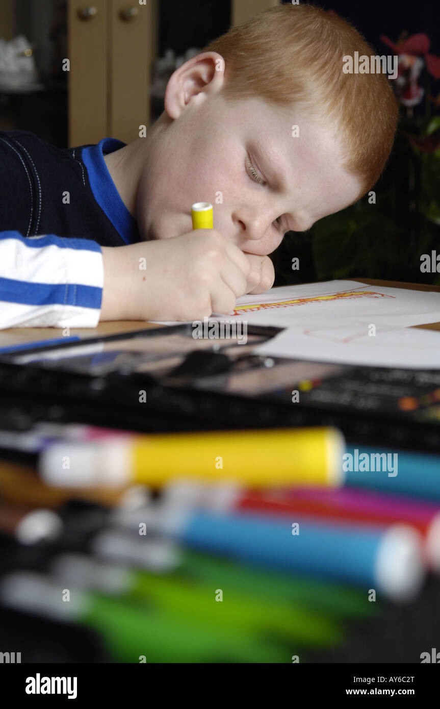 boy drawing with crayons Stock Photo - Alamy