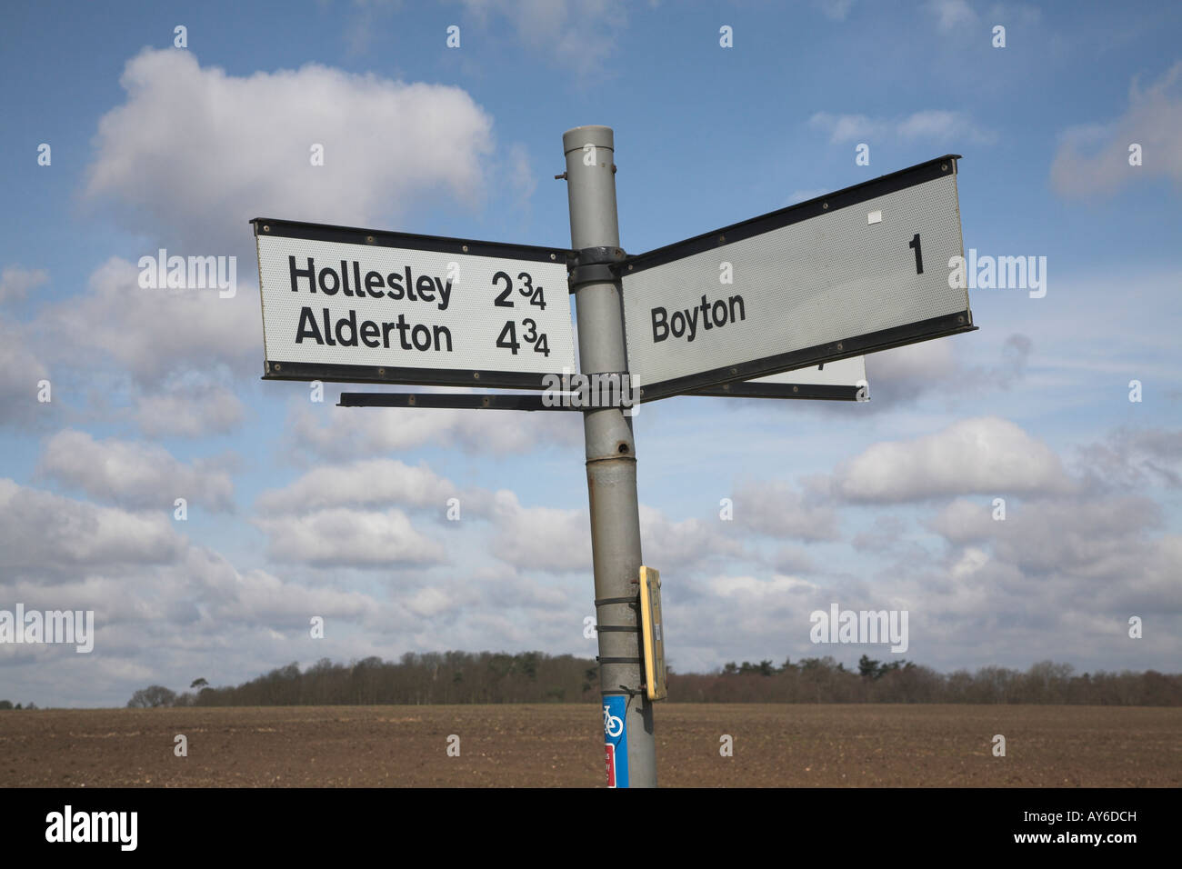 Crossroads road sign pointing four directions in countryside Stock ...