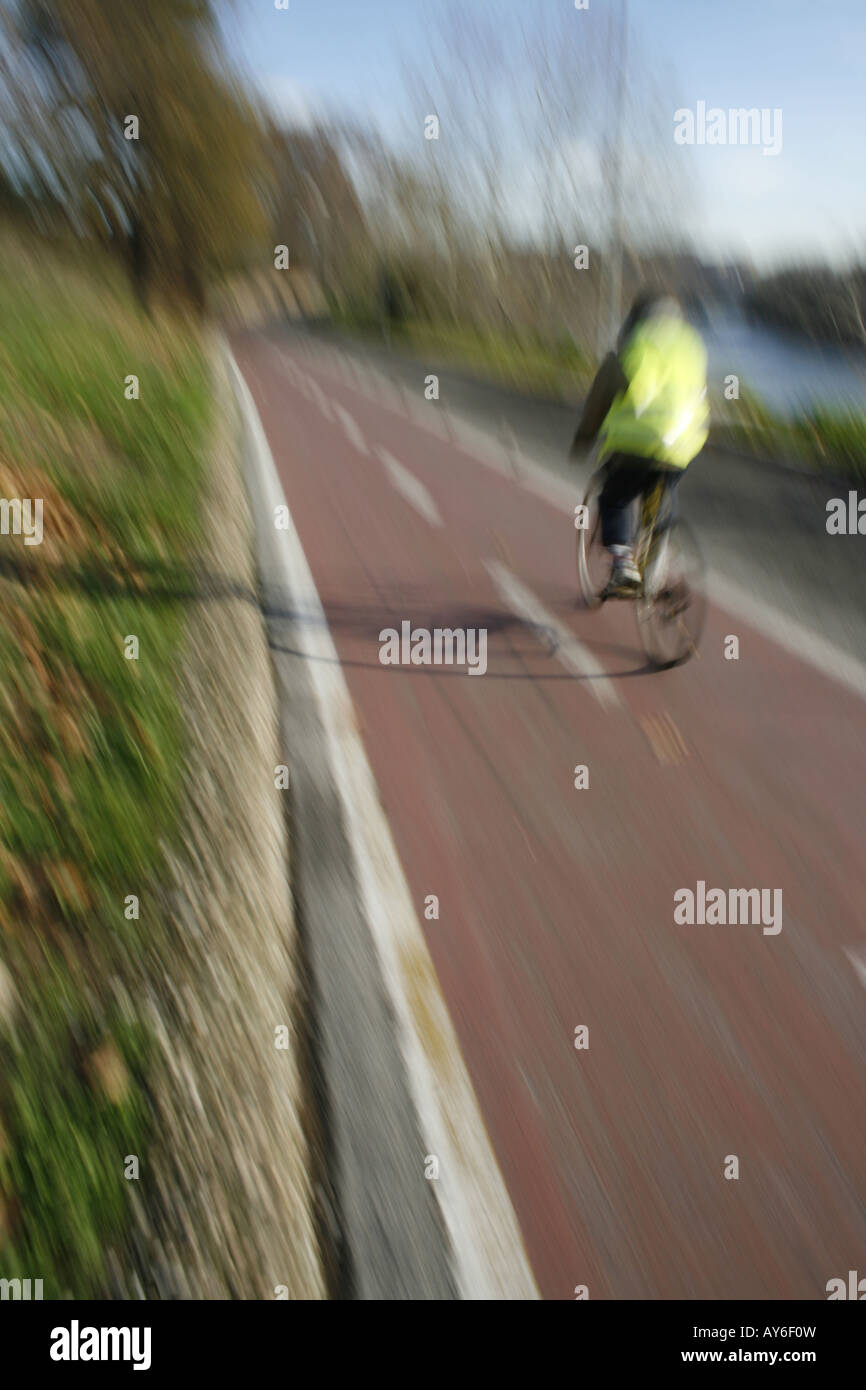 person riding bike on cycle path in country Stock Photo - Alamy