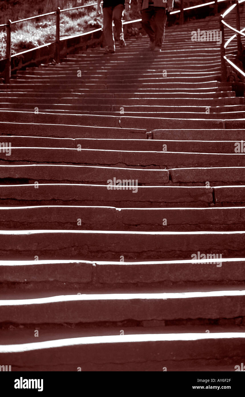 Sea of steps with a hint of somebodys feet at the top Stock Photo - Alamy